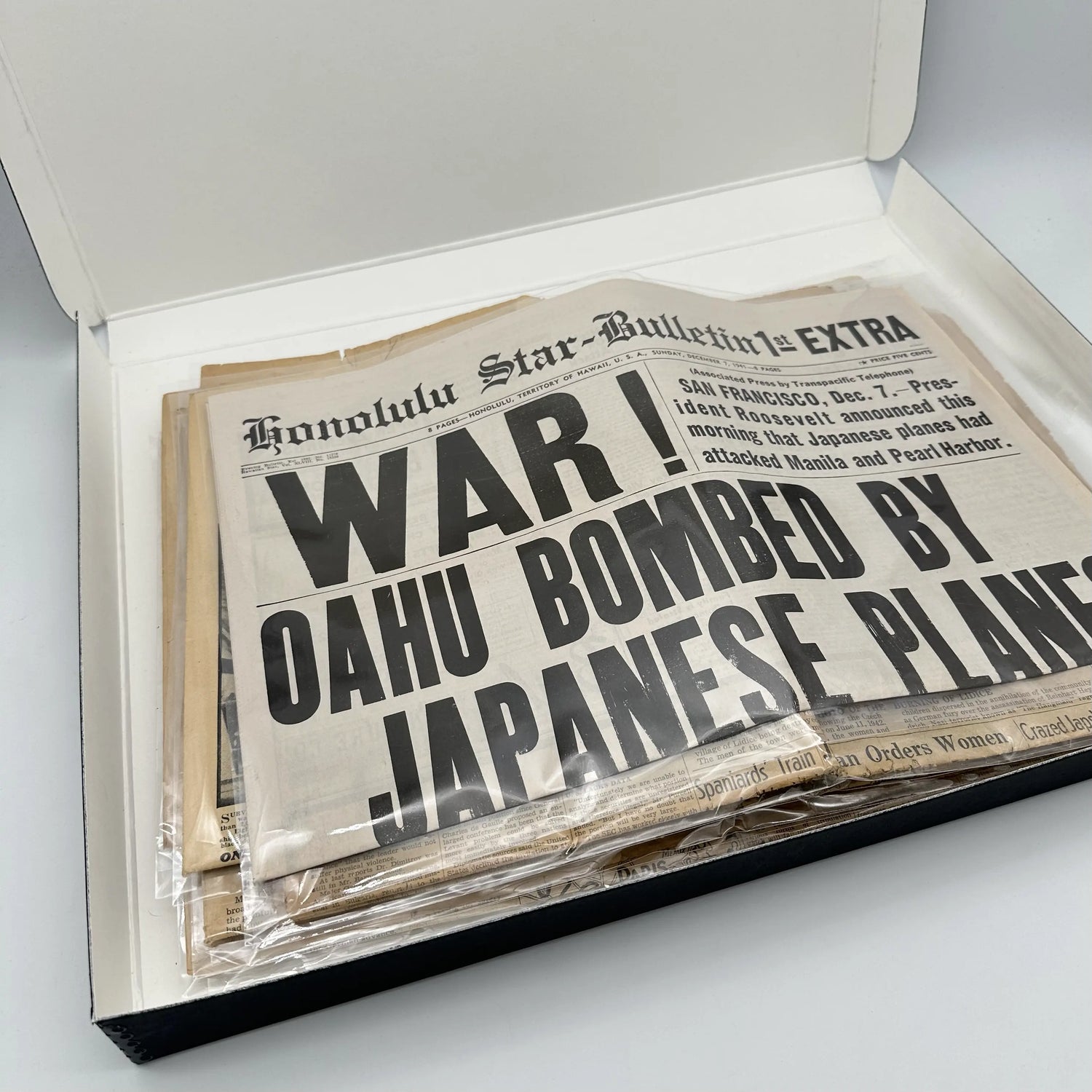 15 World War II Newspapers from the US and UK in an archival box